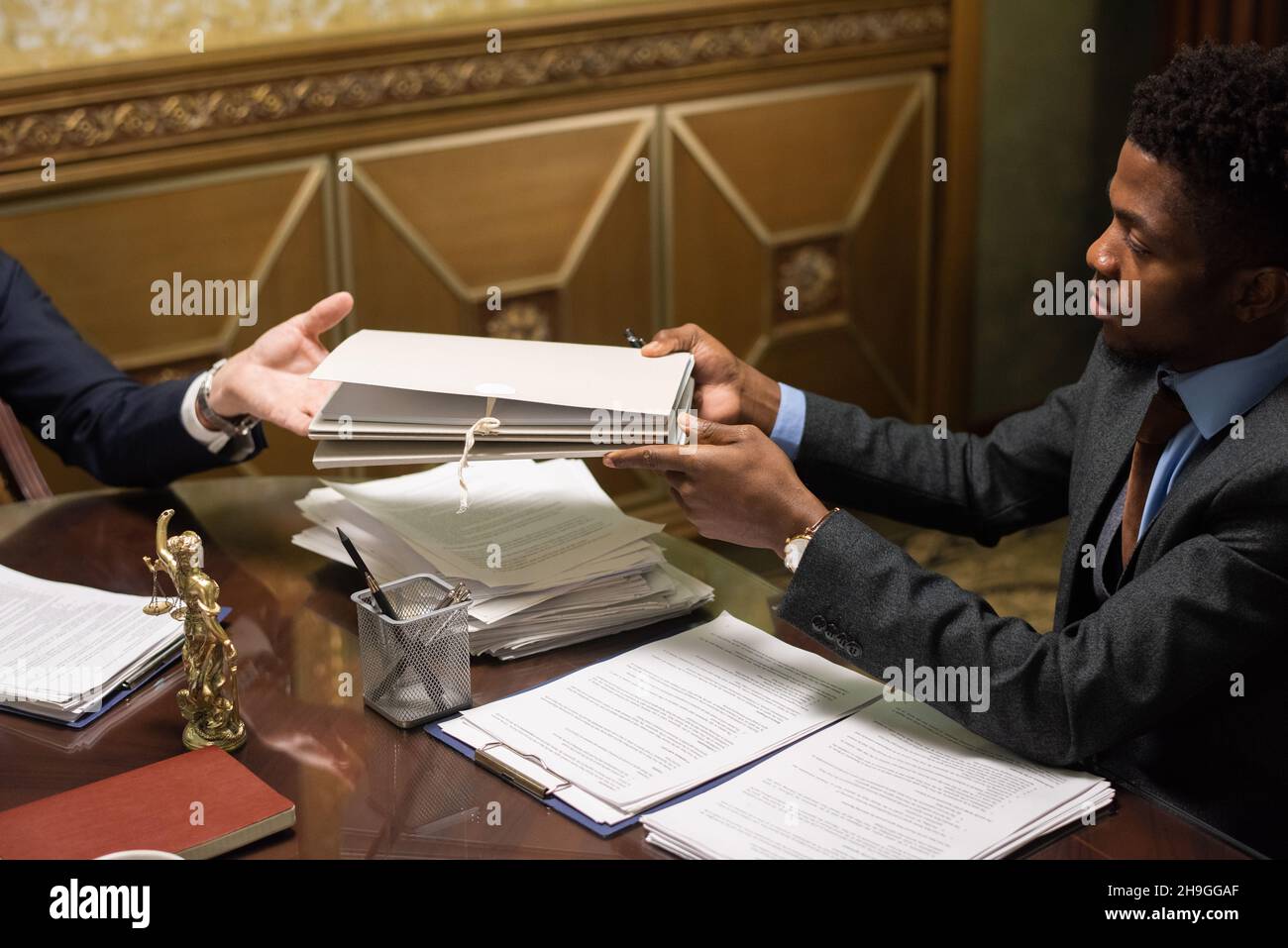 Hand passing papers hi-res stock photography and images - Alamy