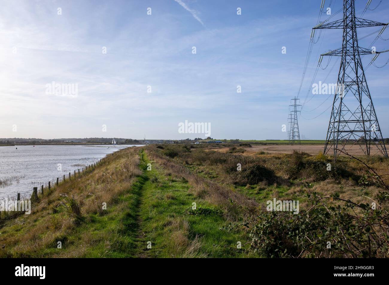 Pylons in the Kent countryside alongside the Swale creek at Faversham ...