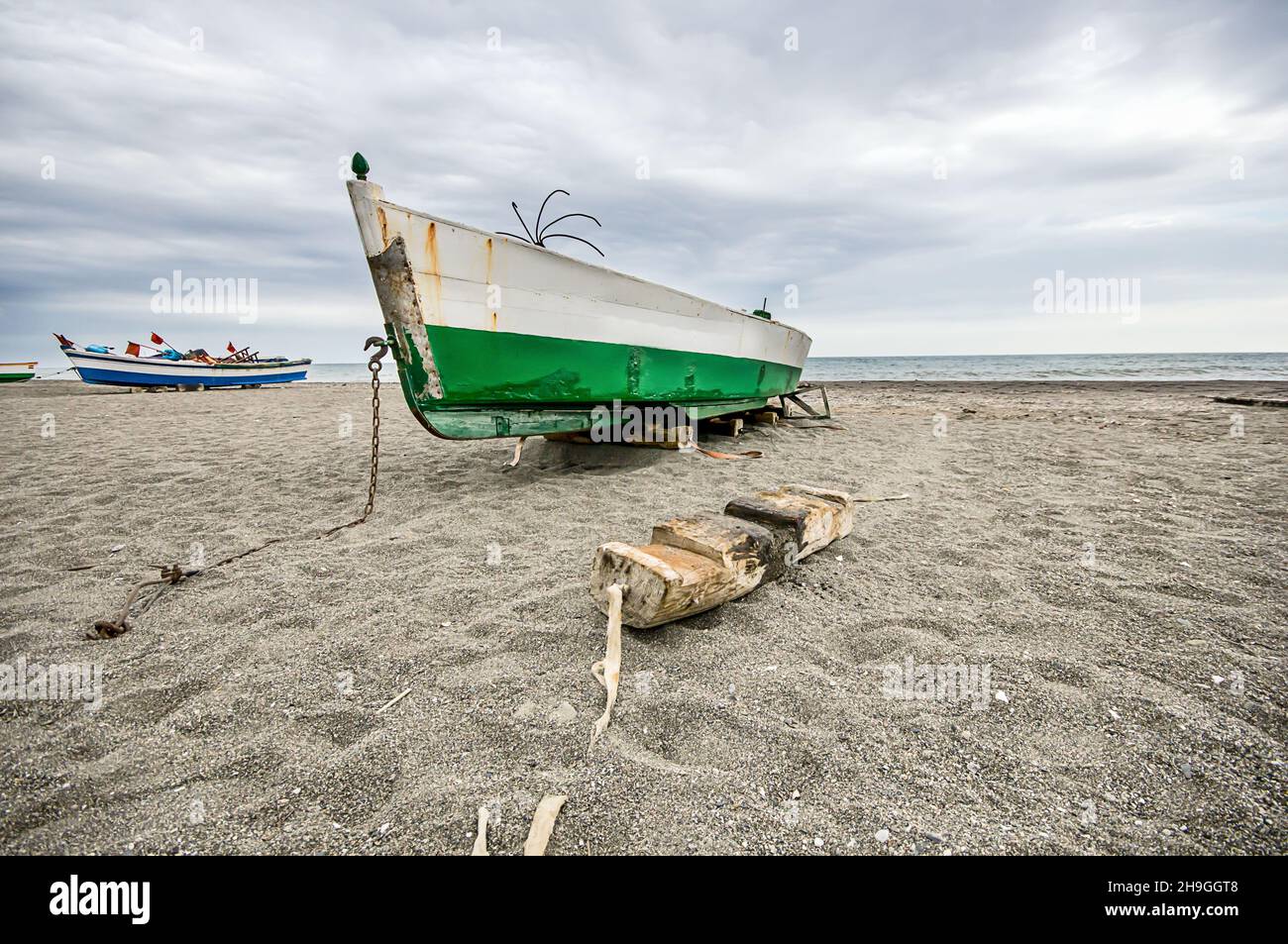 Fishing boat in the beach Stock Photo - Alamy