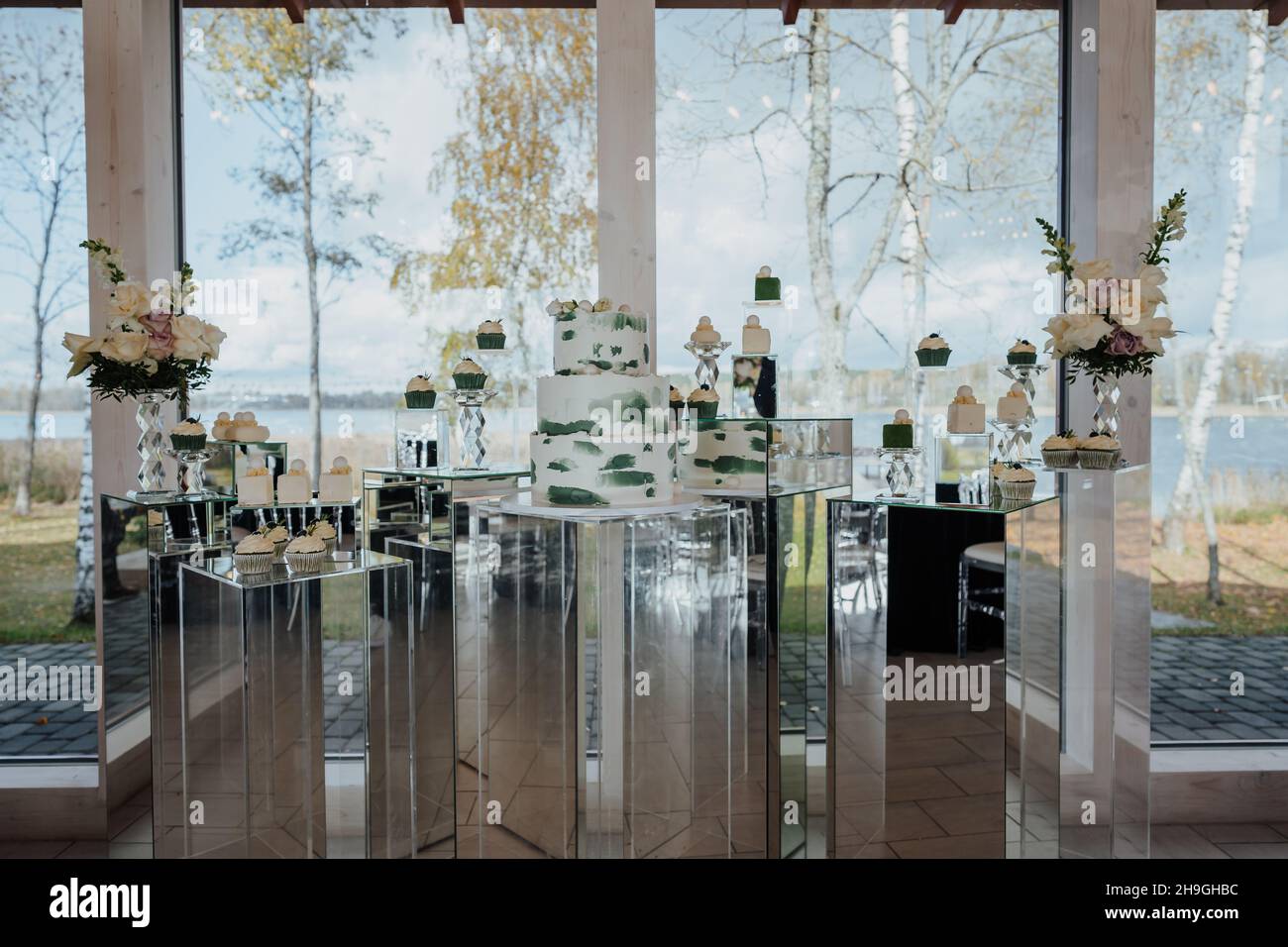 Beautiful luxurious wedding ceremony hall with the cake in the middle ...