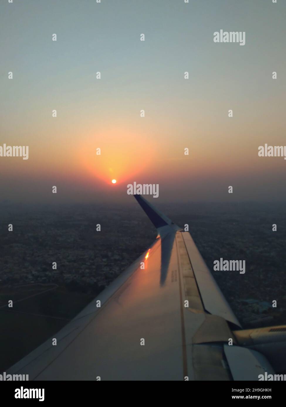 Sunrise through the airplane window Stock Photo - Alamy