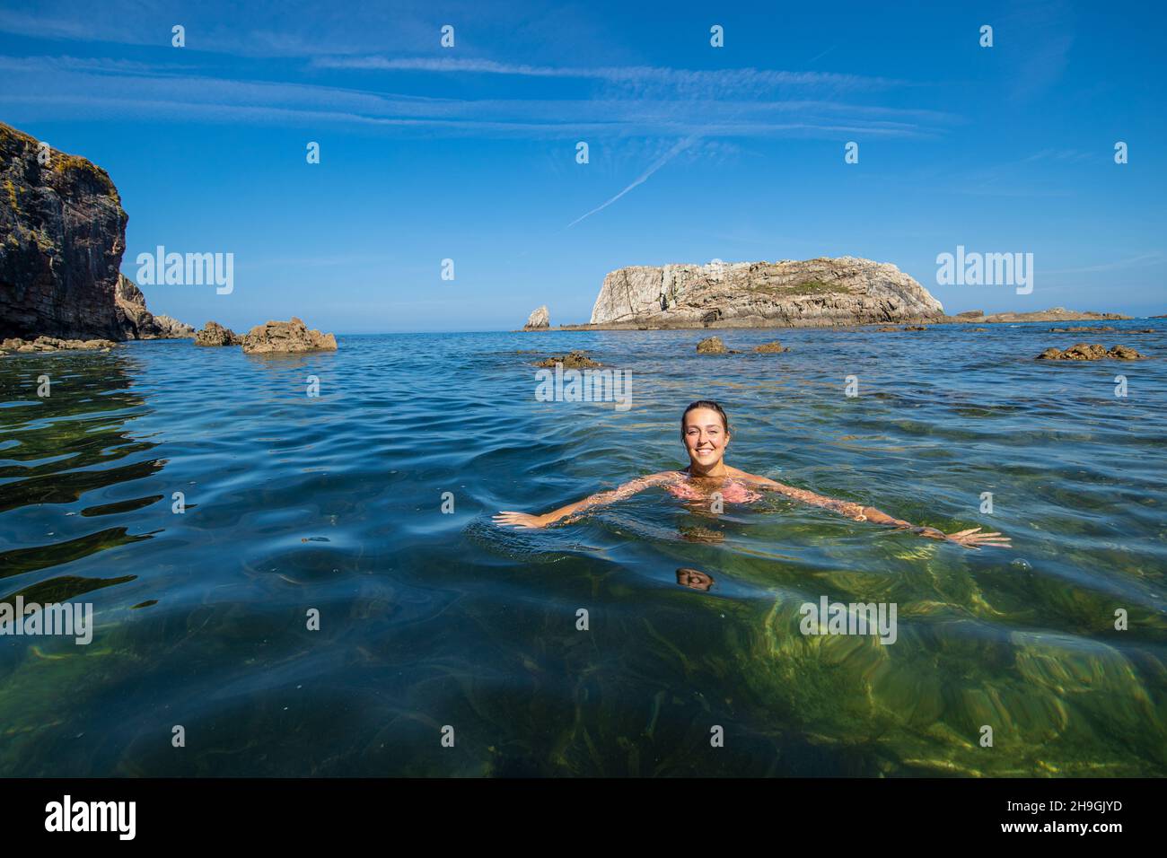 Woman float sea hi-res stock photography and images - Alamy