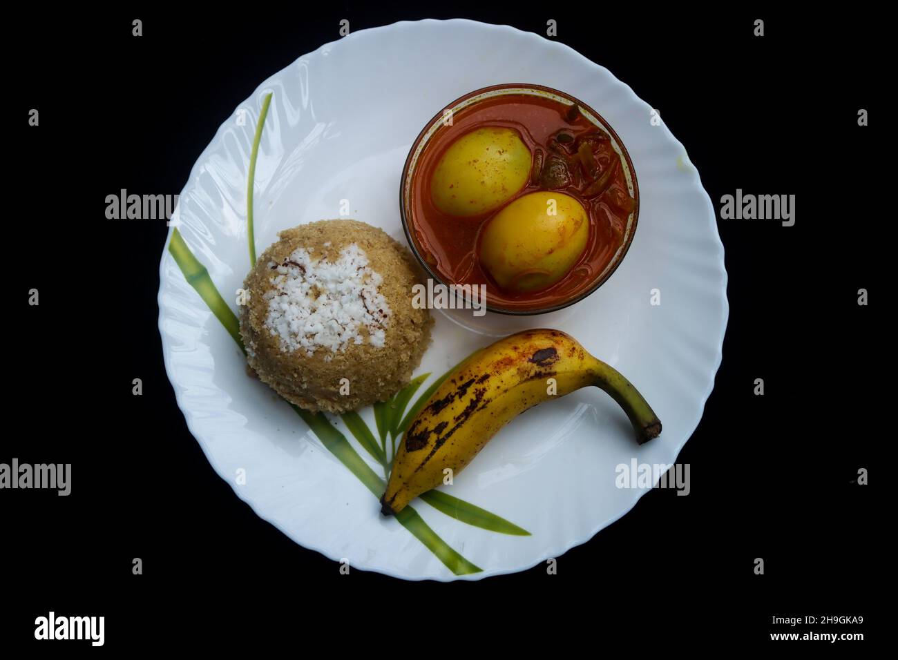 Puttu pazham egg curry Stock Photo - Alamy
