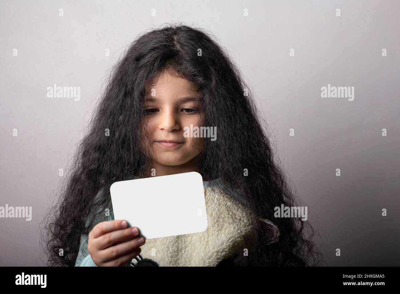 Little girl portrait looking at flash card, preschool educational ...