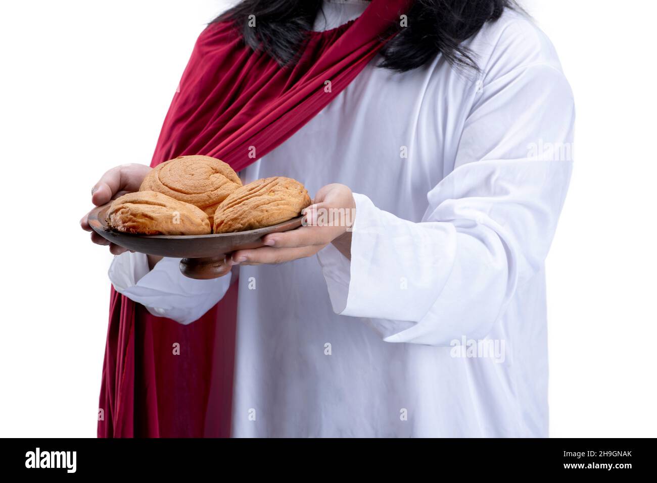 Jesus Christ holding food isolated over white background Stock Photo ...