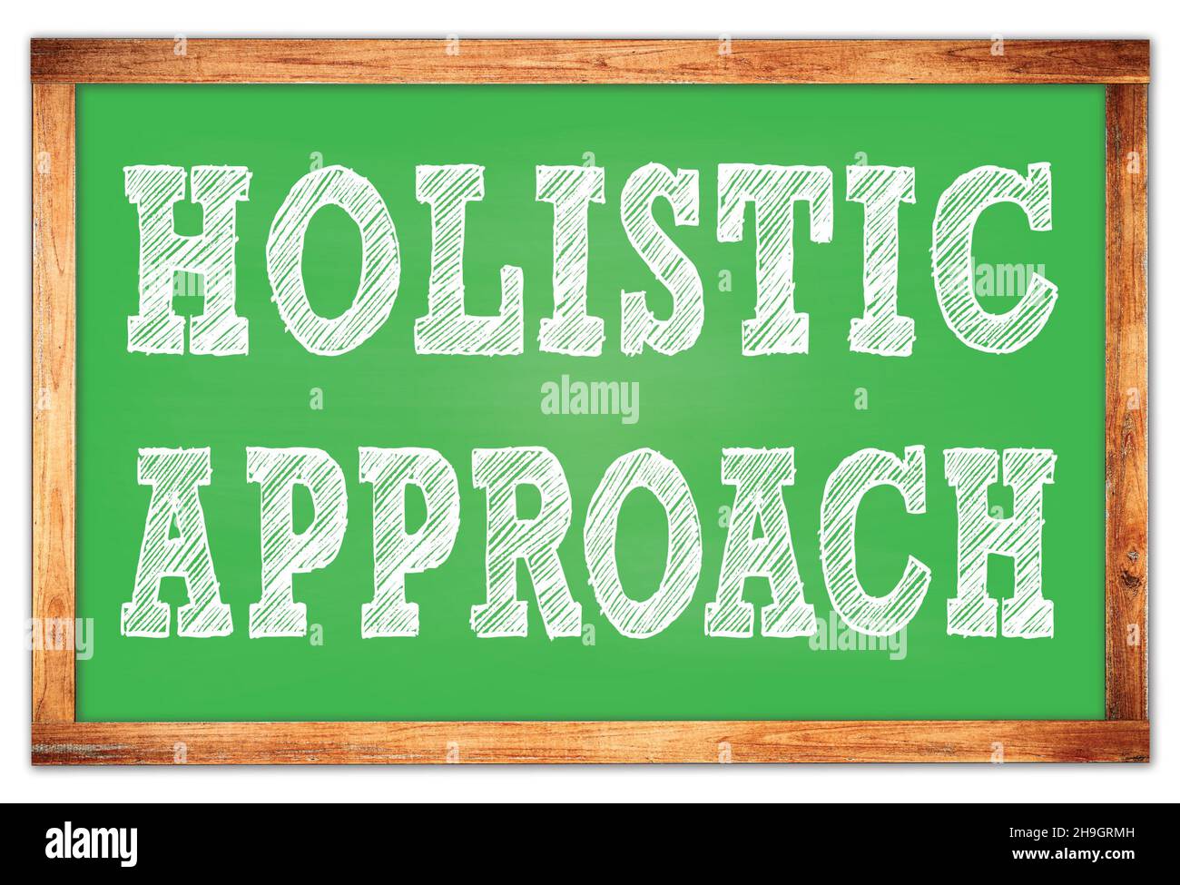 HOLISTIC APPROACH written on green wooden frame school blackboard Stock ...