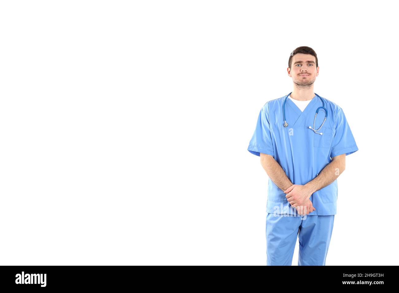 Attractive doctor intern isolated on white background Stock Photo - Alamy
