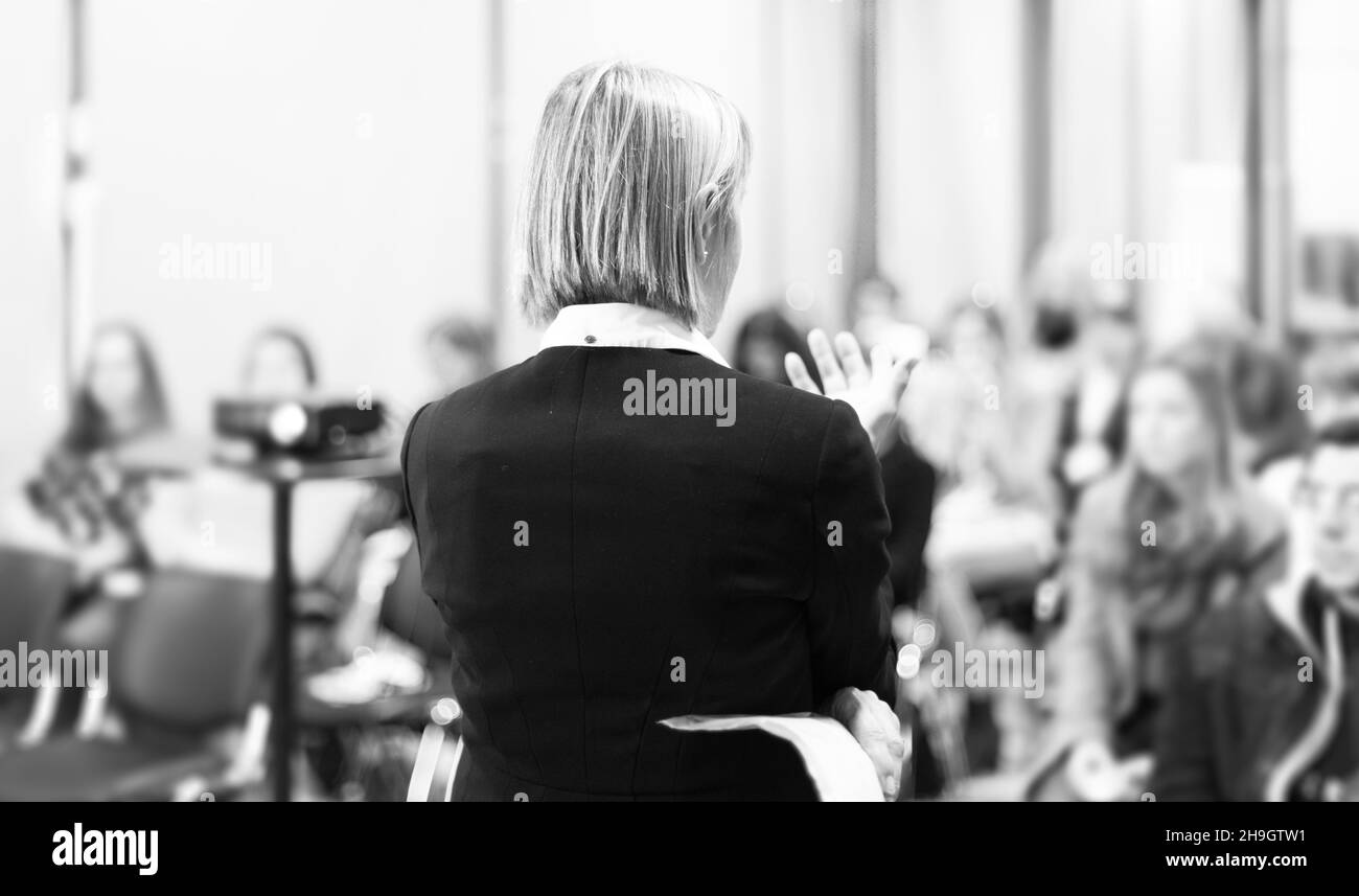 Female public speaker giving talk at Business Event Stock Photo - Alamy