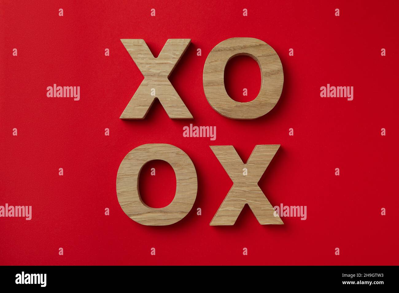 Valentine's Day concept with XO letters on red background Stock Photo ...