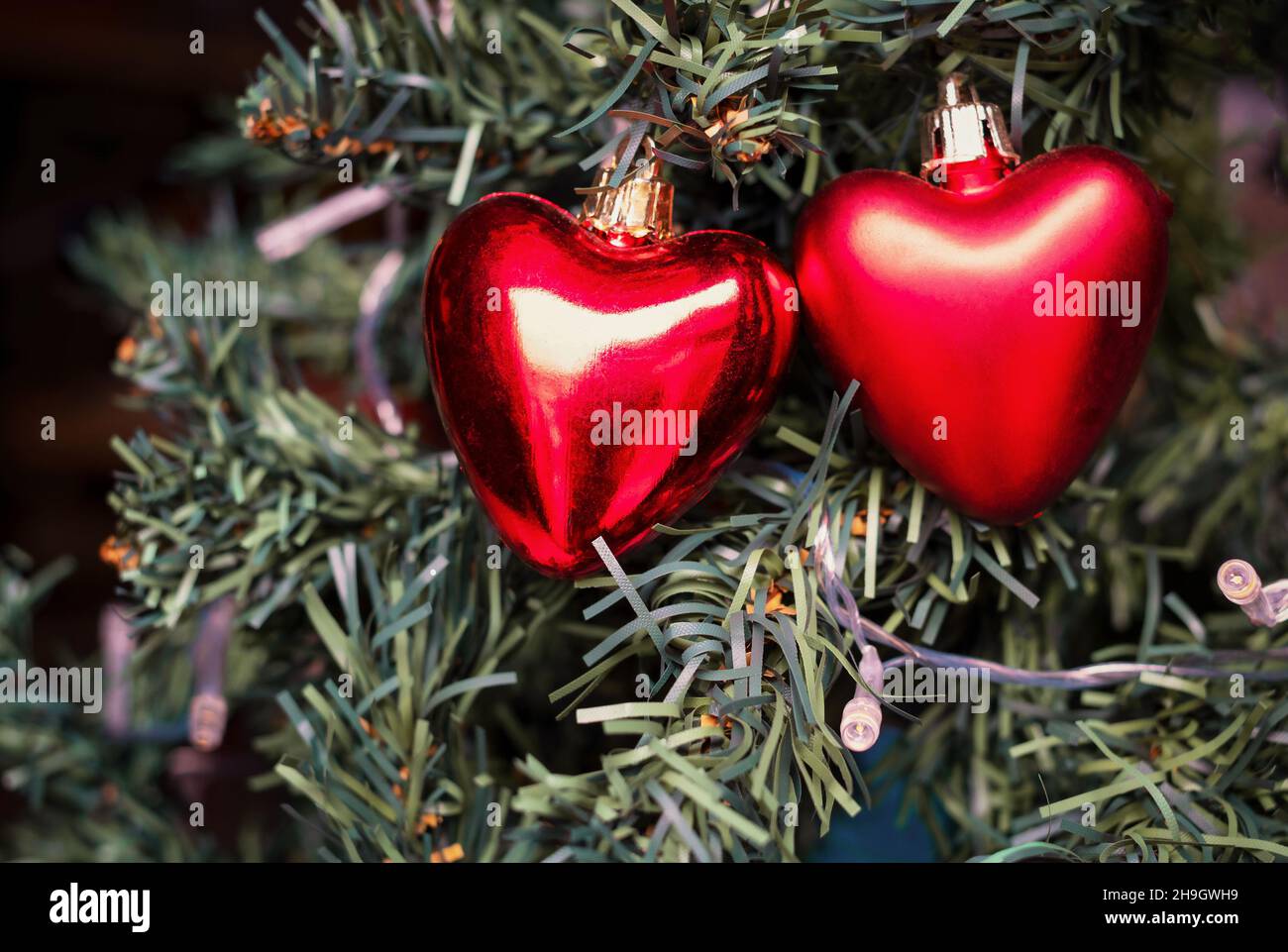two christmas ornate hearts on the christmas tree Stock Photo - Alamy