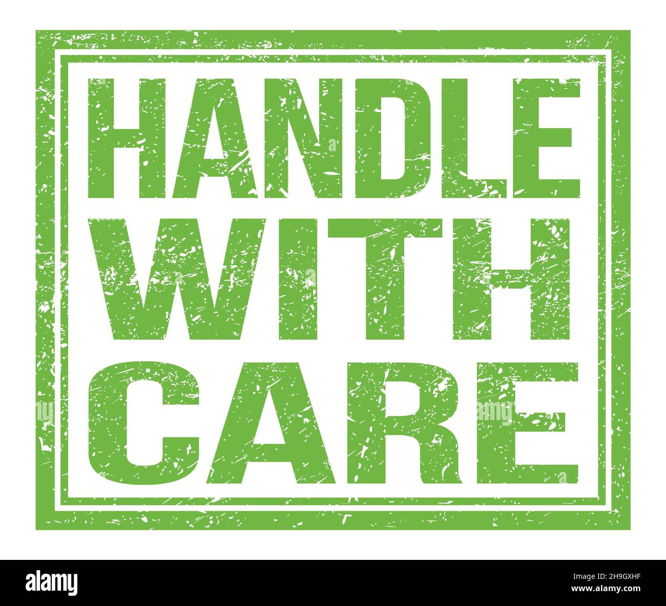 HANDLE WITH CARE, written on green grungy stamp sign Stock Photo - Alamy