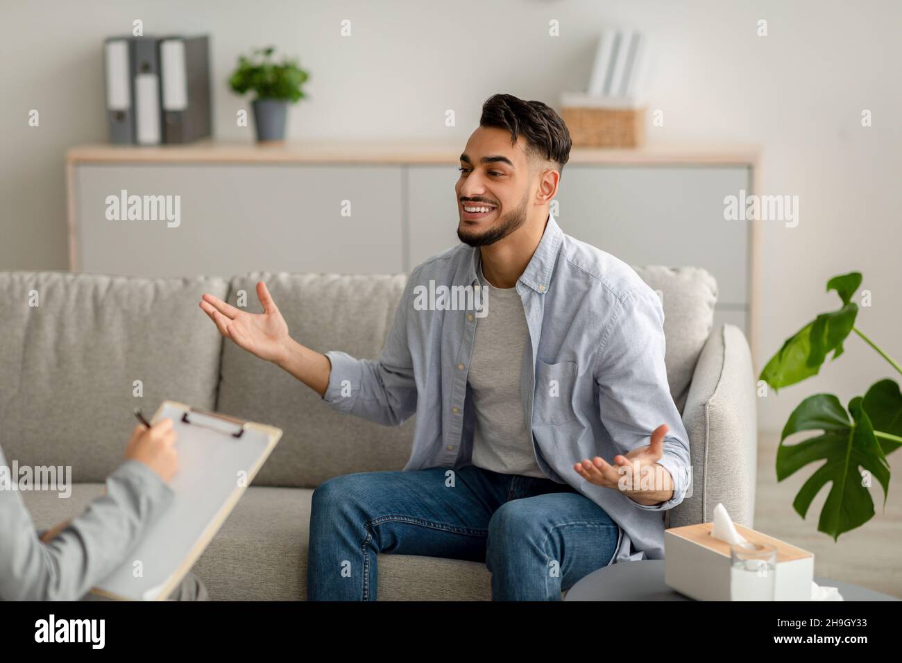 Happy professional guy talking hi-res stock photography and images - Alamy