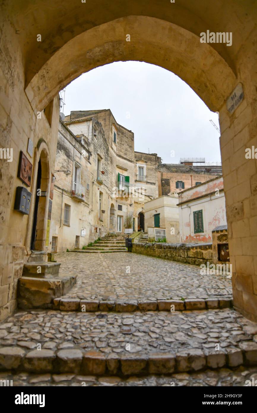 A street in Matera, an ancient city built into the rock. It is located ...