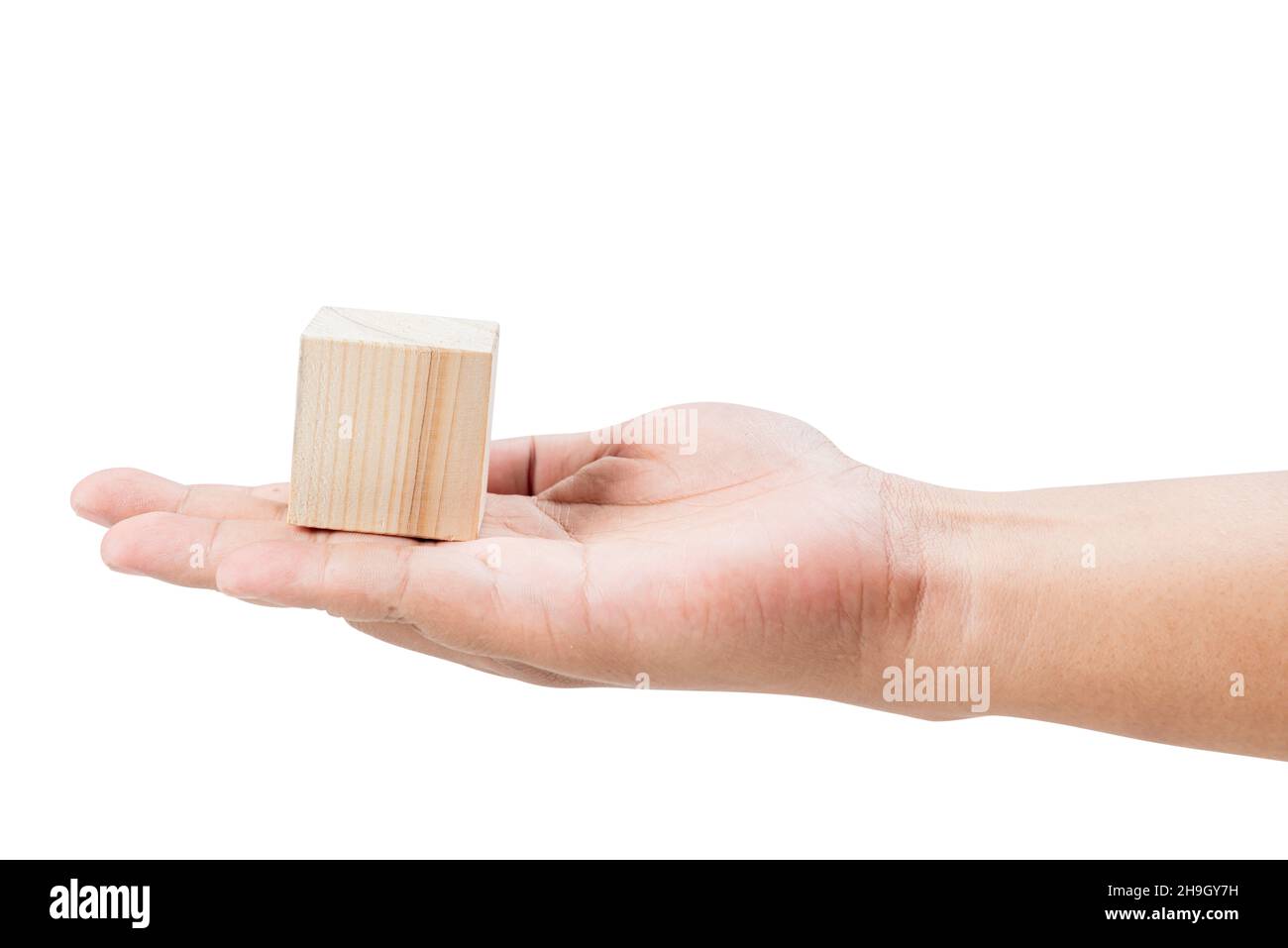 Hand holding wooden block toy isolated over white background Stock ...