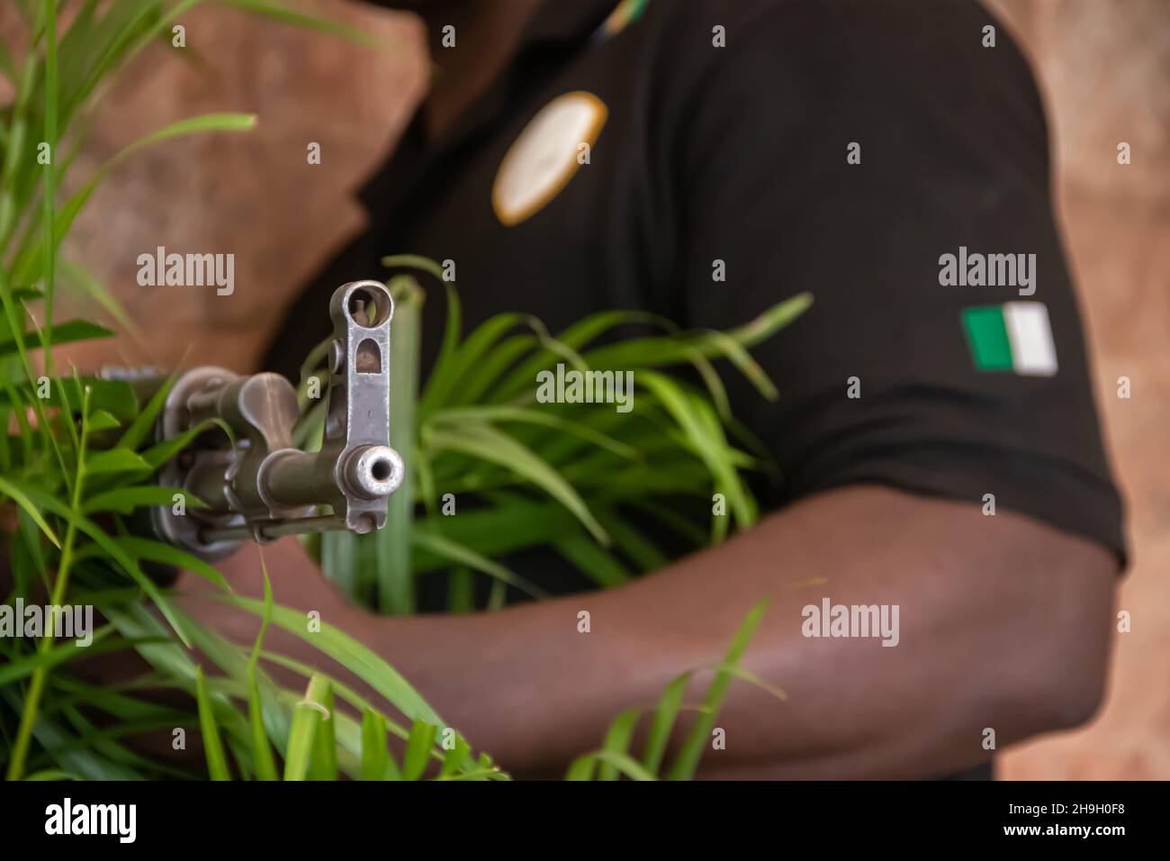Member of Nigeria special forces holding Kalashnikov aka AK47, resting ...