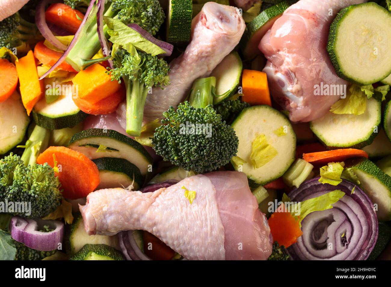 Raw vegetables with chicken drumsticks, top view Stock Photo - Alamy