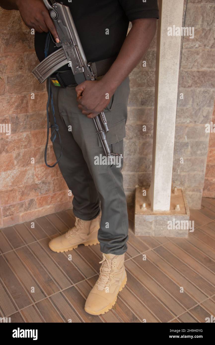 Member of Nigeria special forces holding Kalashnikov aka AK47, resting ...