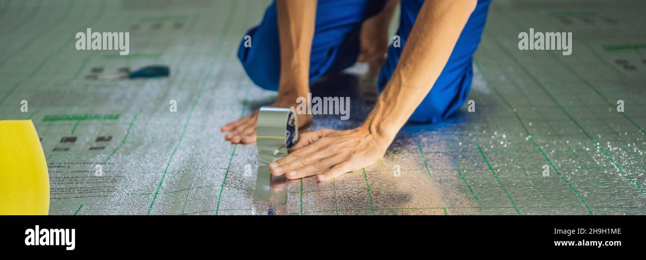 BANNER, LONG FORMAT Master installs the overlapping thermal insulation ...