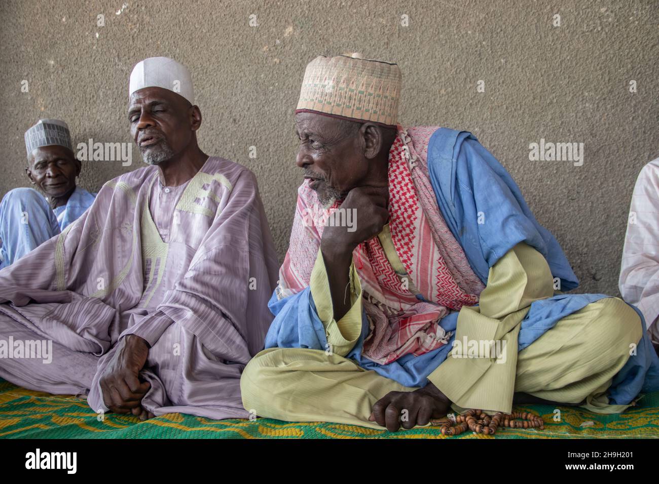 Village leaders (elders) in African village, traditionally dressed in ...