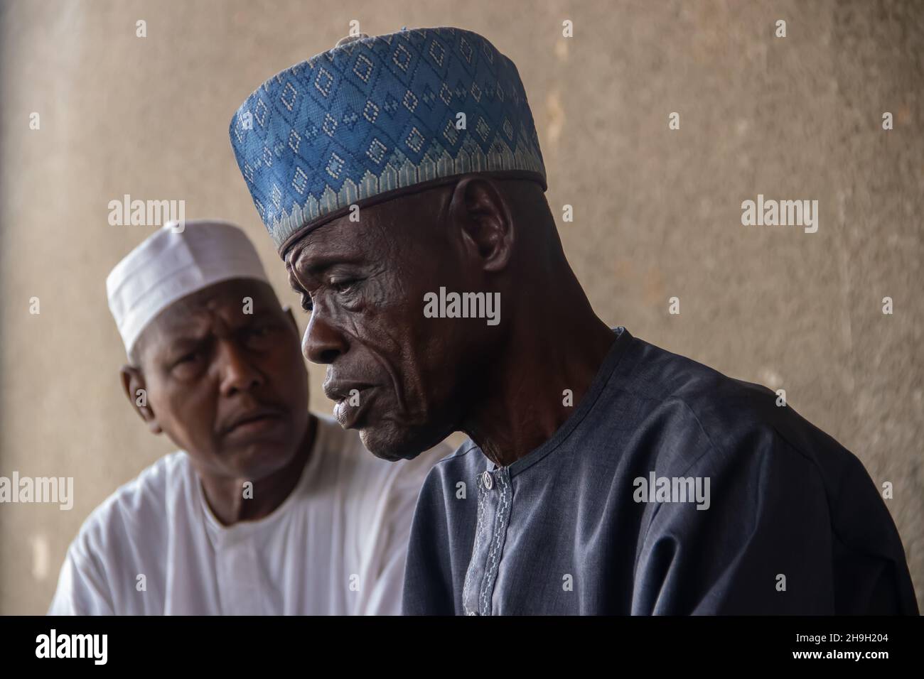 Village leaders (elders) in African village, traditionally dressed in ...