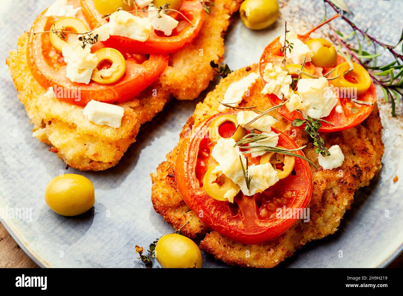Schnitzel, breaded and fried thin layer of meat. Austrian dish ...