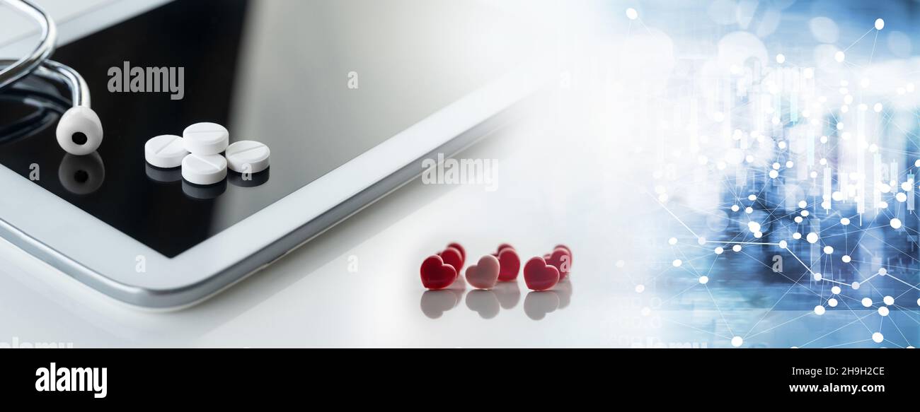 stethoscope and drug pill and pink red heart and tablet computer for ...