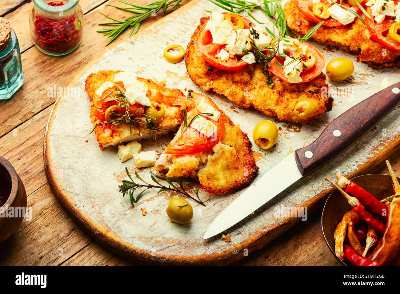 Schnitzel, breaded and fried thin layer of meat. Cretan schnitzel Stock ...