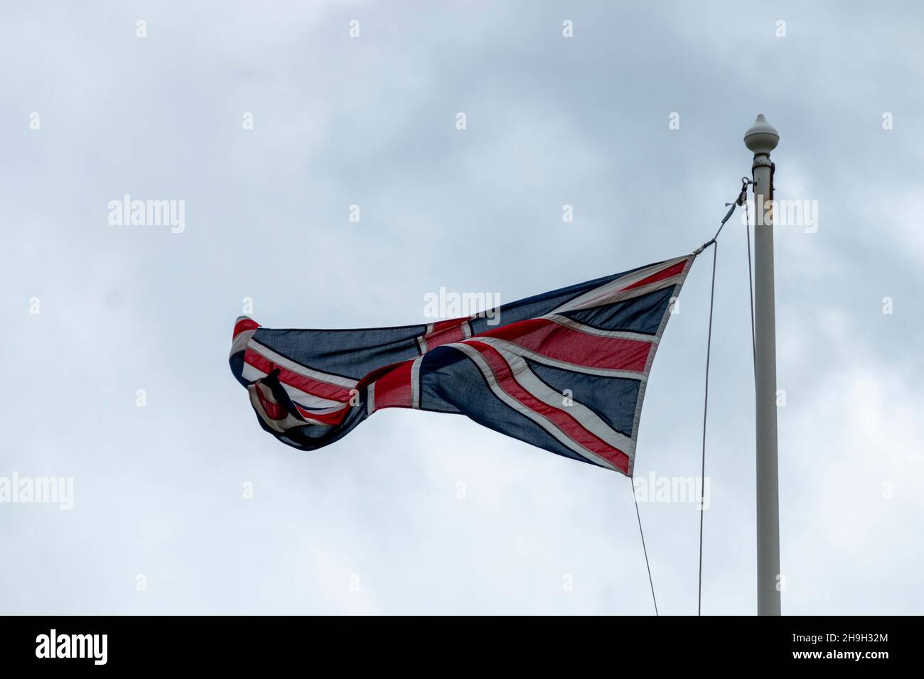 The british flag flowing in the wind Stock Photo - Alamy