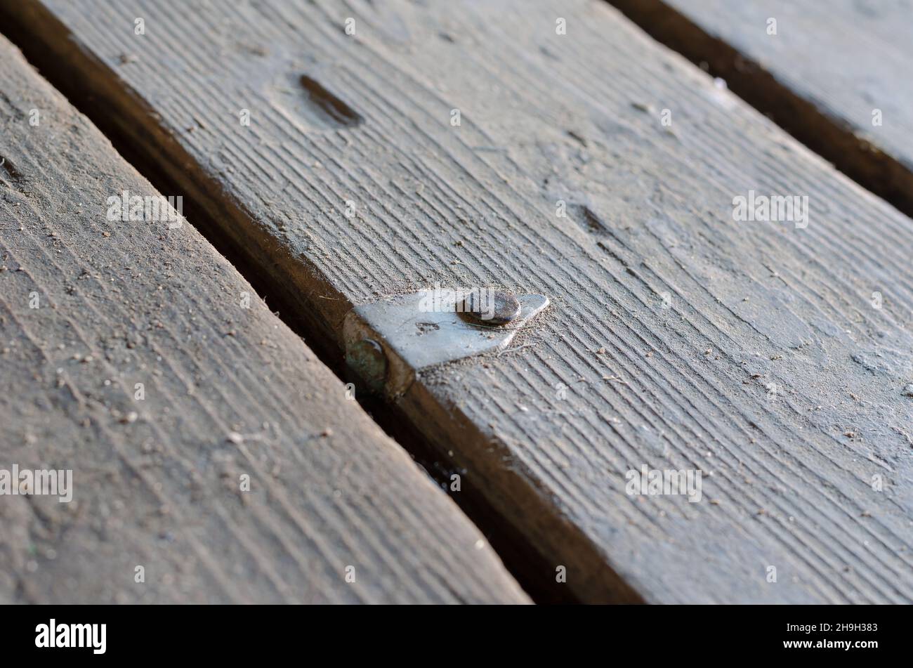 The number 4 on the metal tag. Old numbered boards on the floor. Dirty ...