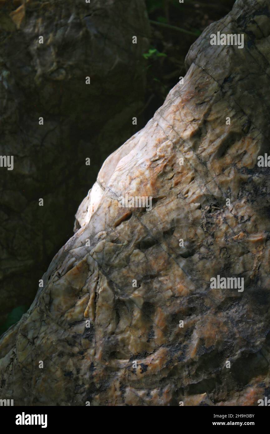 Huge pink granite boulder in the bright sunshine Stock Photo - Alamy
