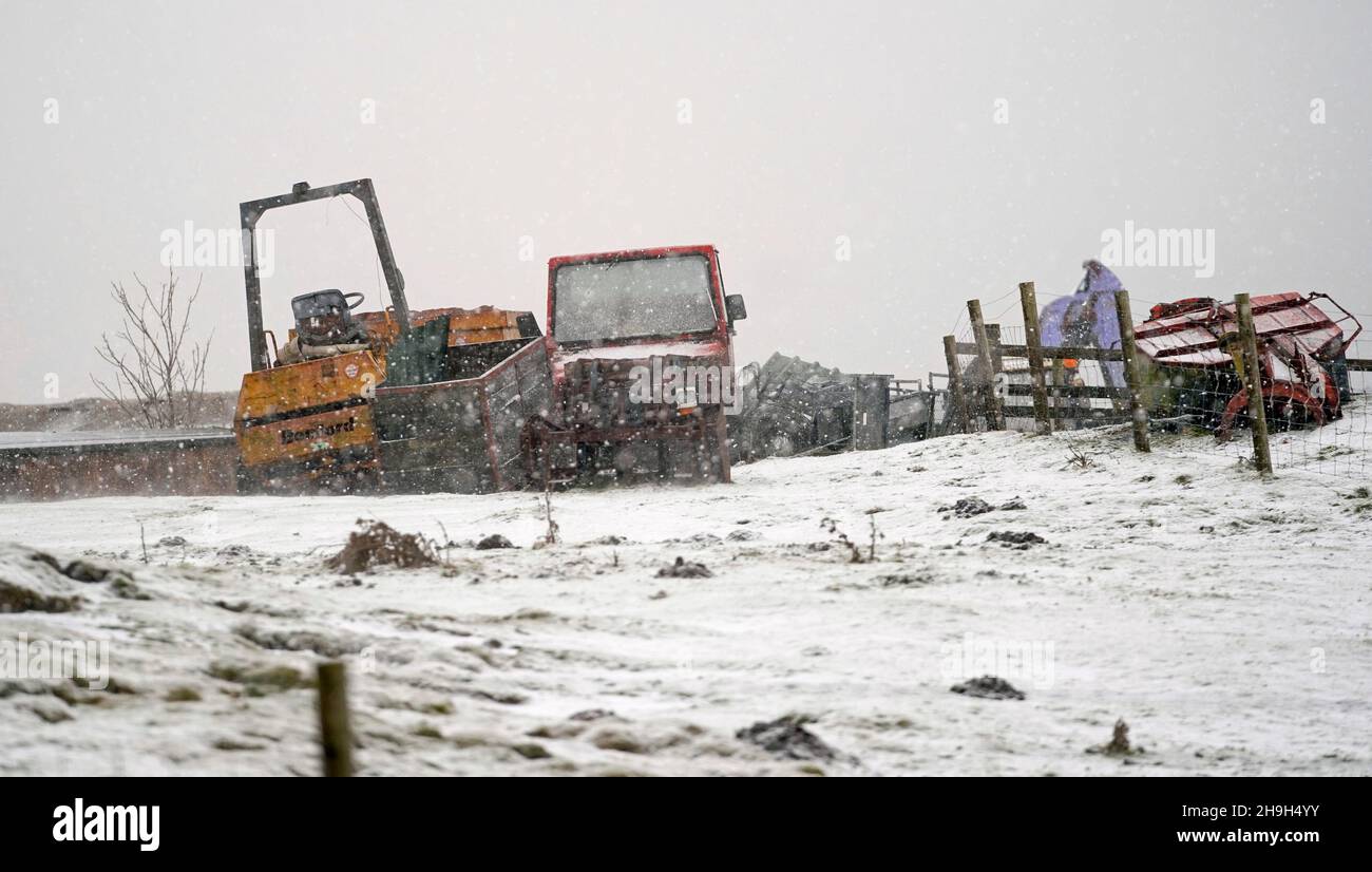 Snow falls near equipment on the A66 between Stainmore and Bowes as ...