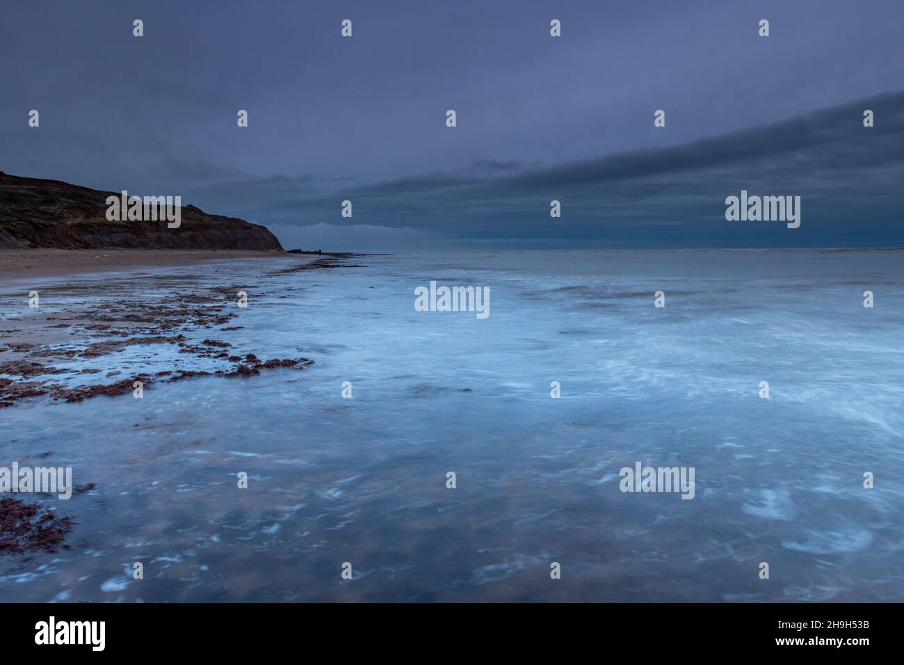 evening light over beach on isle of wight, isle of wight, coastal ...
