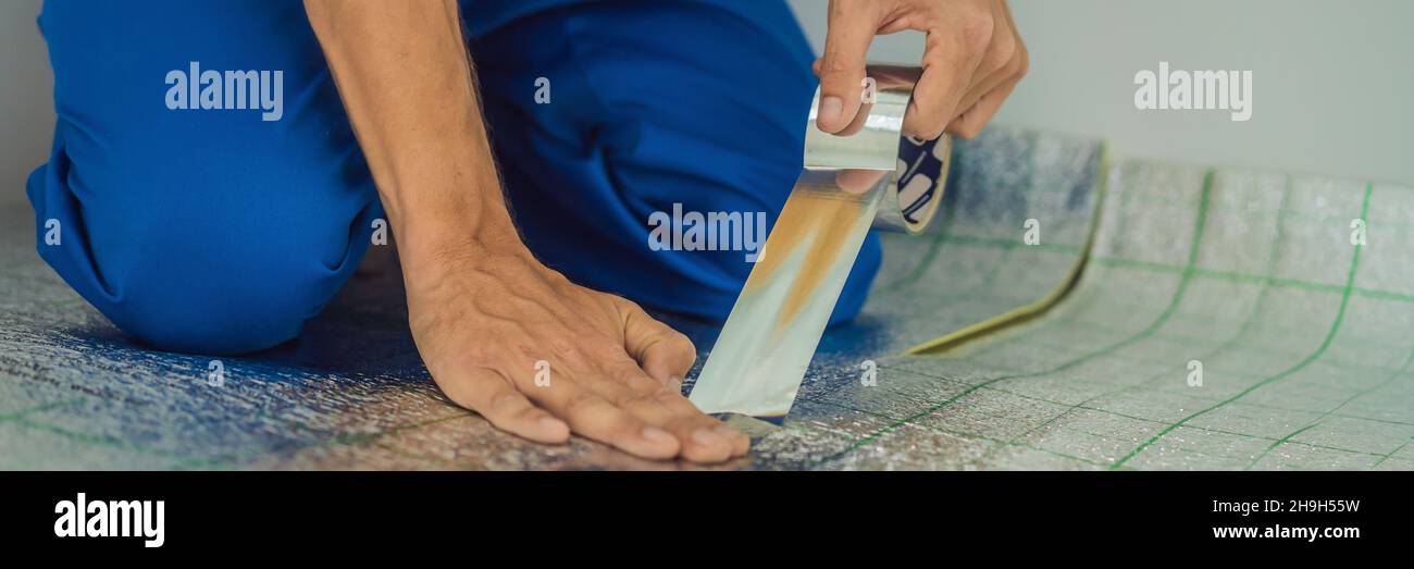 BANNER, LONG FORMAT Master installs the overlapping thermal insulation ...