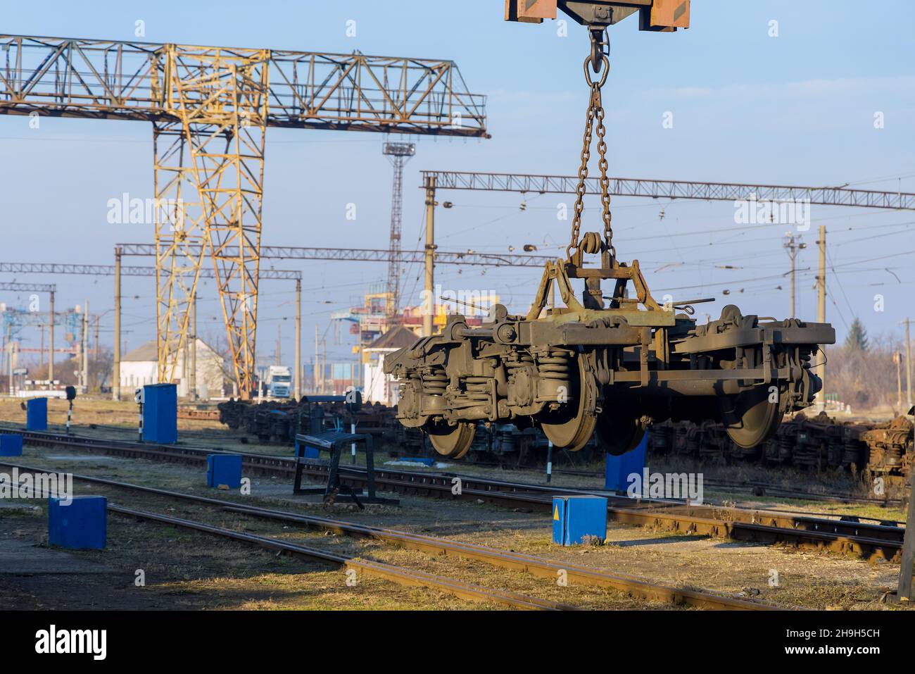 Railway depot stations with industrial crane that raises the driving ...