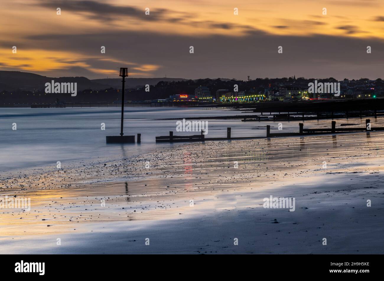 sunset over sandown beach on the isle of wight coast, coastline of the ...