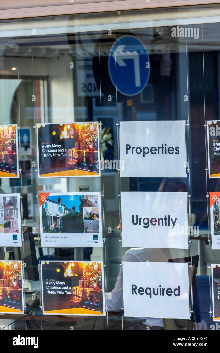 properties urgently wanted sign in the window of a high street estate ...