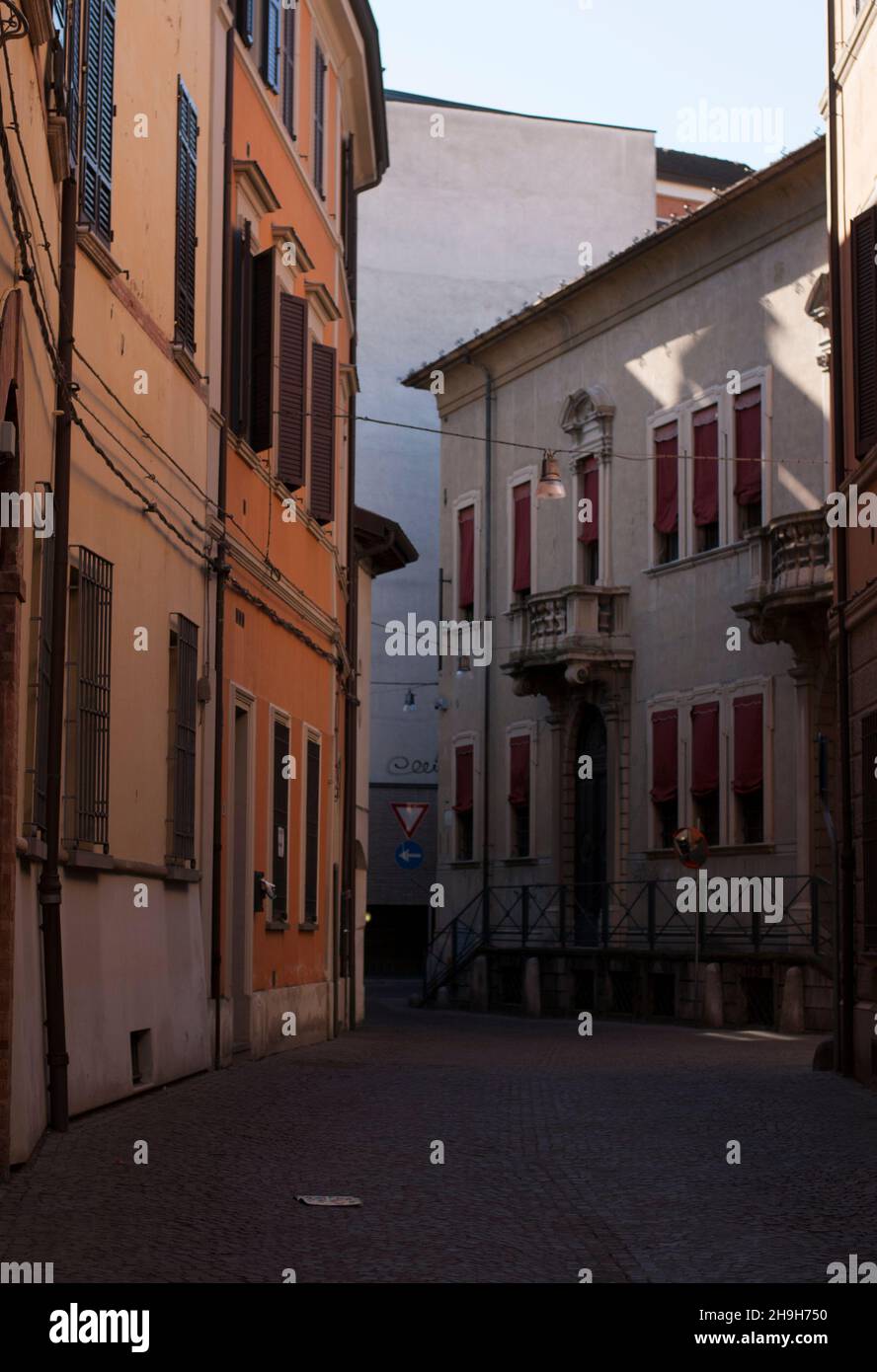 View on street with buildings in Italian city Stock Photo - Alamy