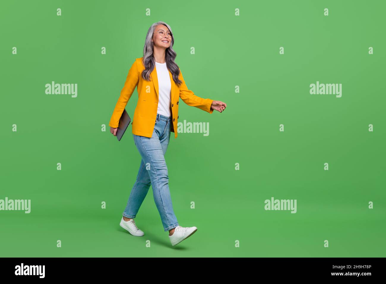 Full size profile side photo of senior lady walk smart casual marketer ...