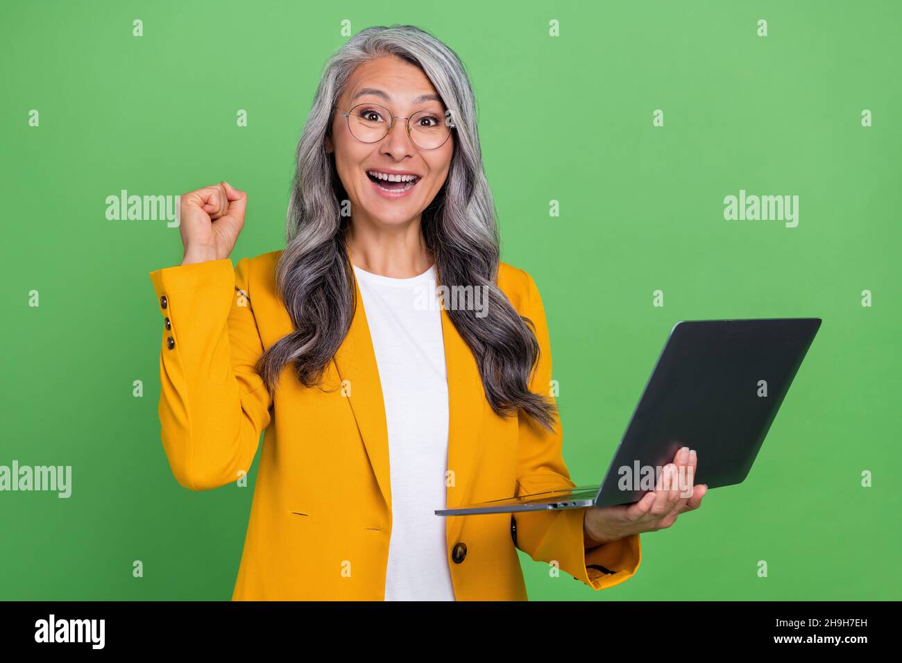 Photo of mature woman celebrate victory goal lucky fists hand marketer ...