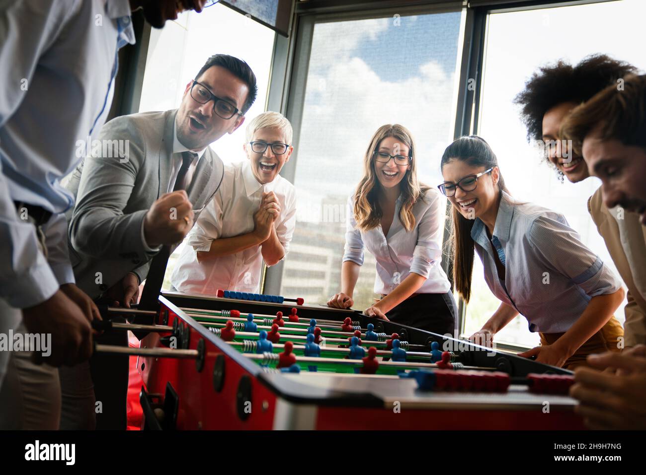 Employees playing table football hi-res stock photography and images ...