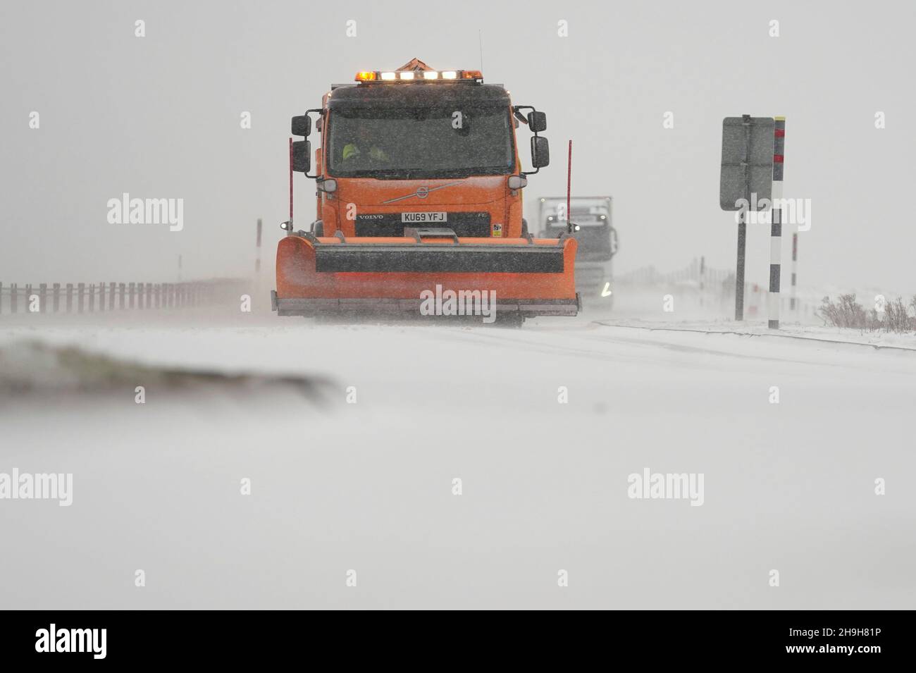A snowplough makes its way through falling snow on the A66 between ...