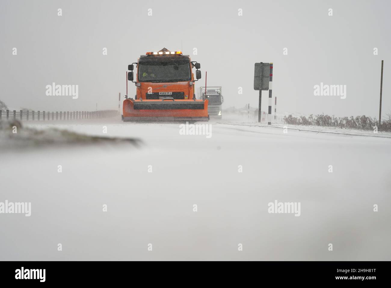 A snowplough makes its way through falling snow on the A66 between ...