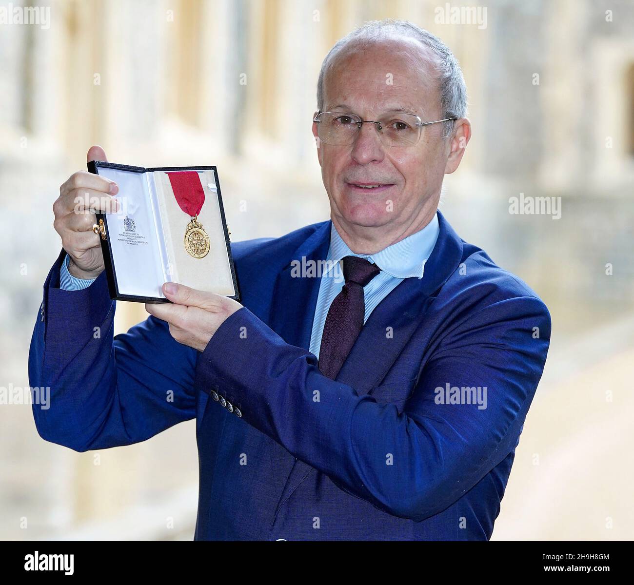 Peter Betts from London with his award after he was made a Companion ...