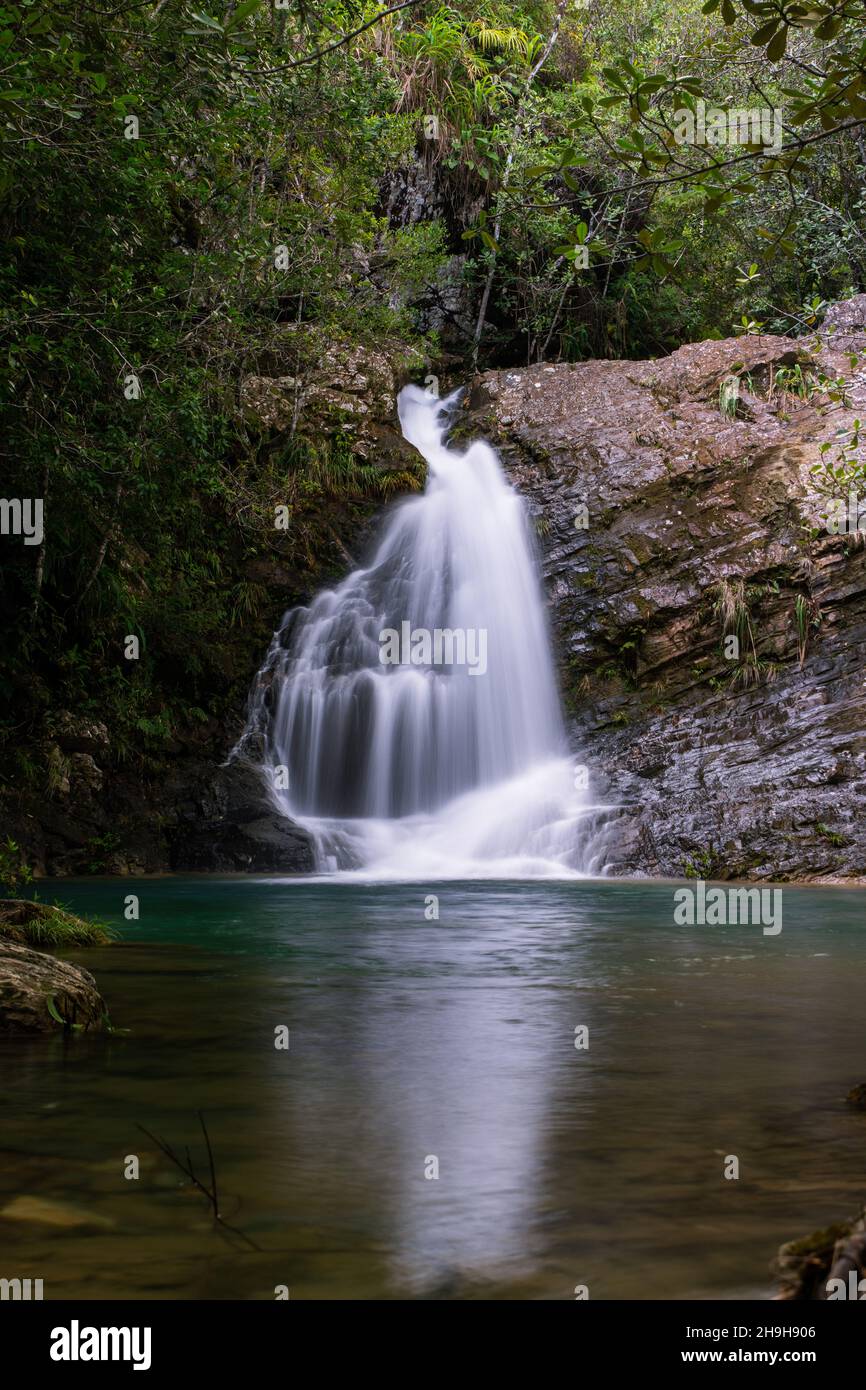 Beautiful small waterfall flowing over the rocks Stock Photo - Alamy