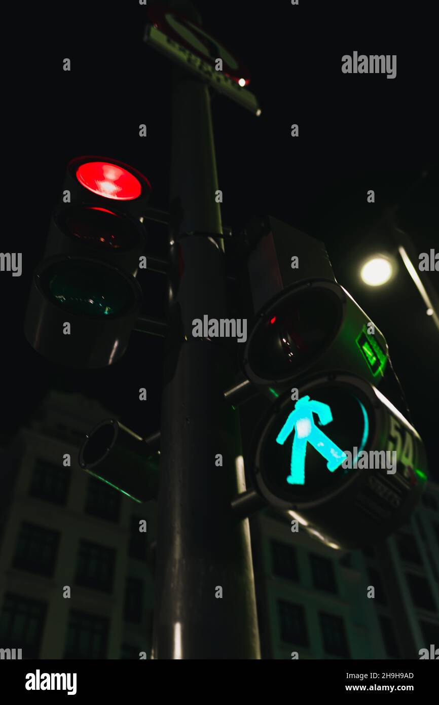 Vertical shot of traffic lights during nighttime Stock Photo - Alamy