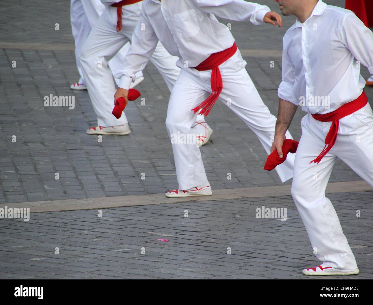 Group of people dancing folk dance outdoors in the Basque Country Stock ...