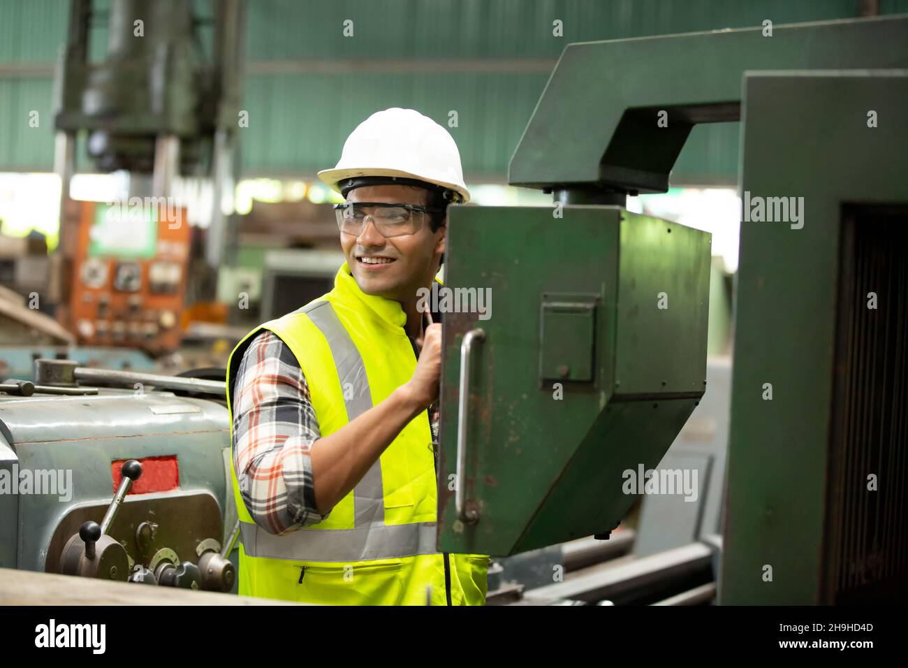 Industrial Engineers in Hard Hats.Work at the Heavy Industry Manufacturing Factory.industrial ...