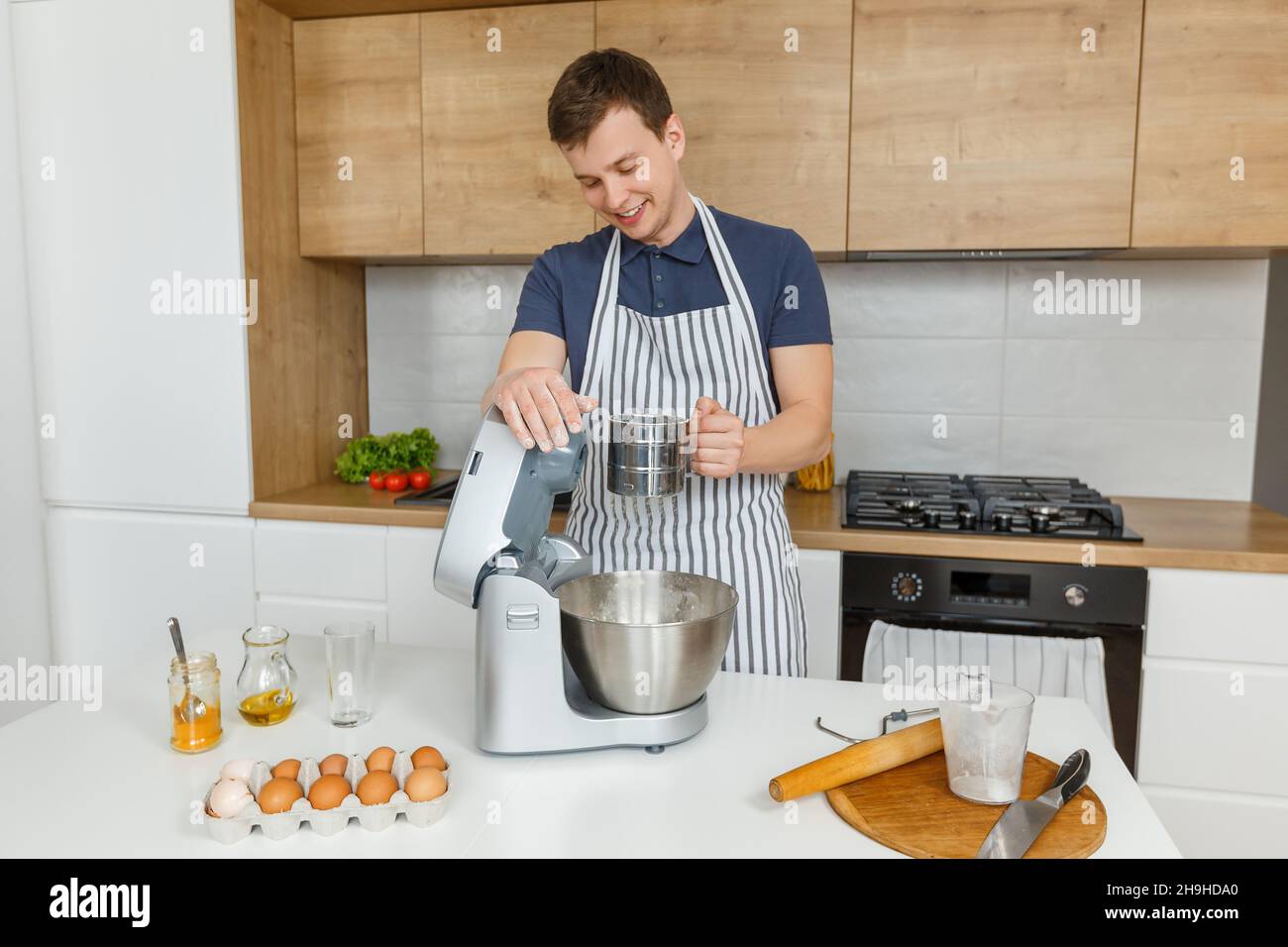 Man in apron hi-res stock photography and images - Alamy