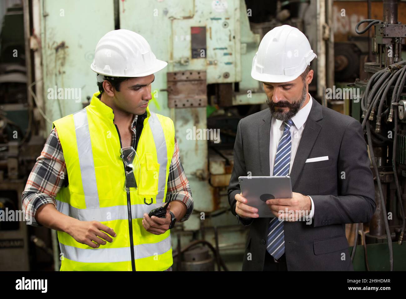 Industrial Engineers in Hard Hats.Work at the Heavy Industry ...