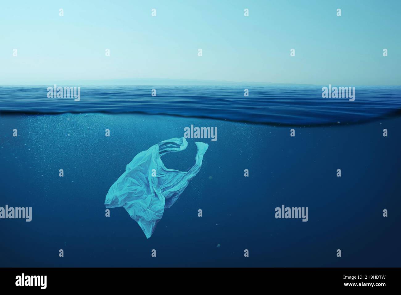 Creative background, plastic bag floating in the ocean, bag in the ...